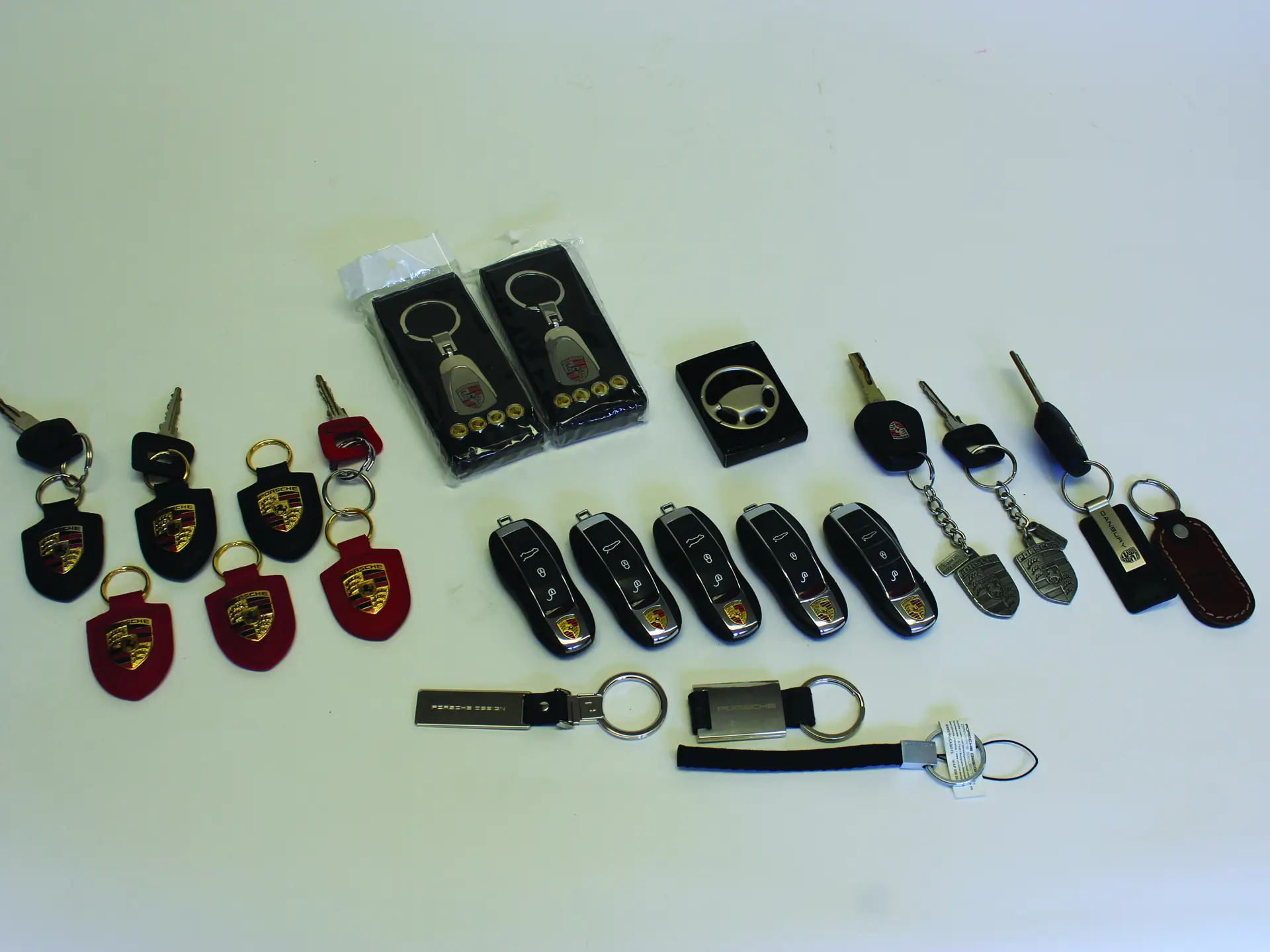 A grouping of Porsche Key fobs and keys. | Fort Lauderdale 2017 | RM ...