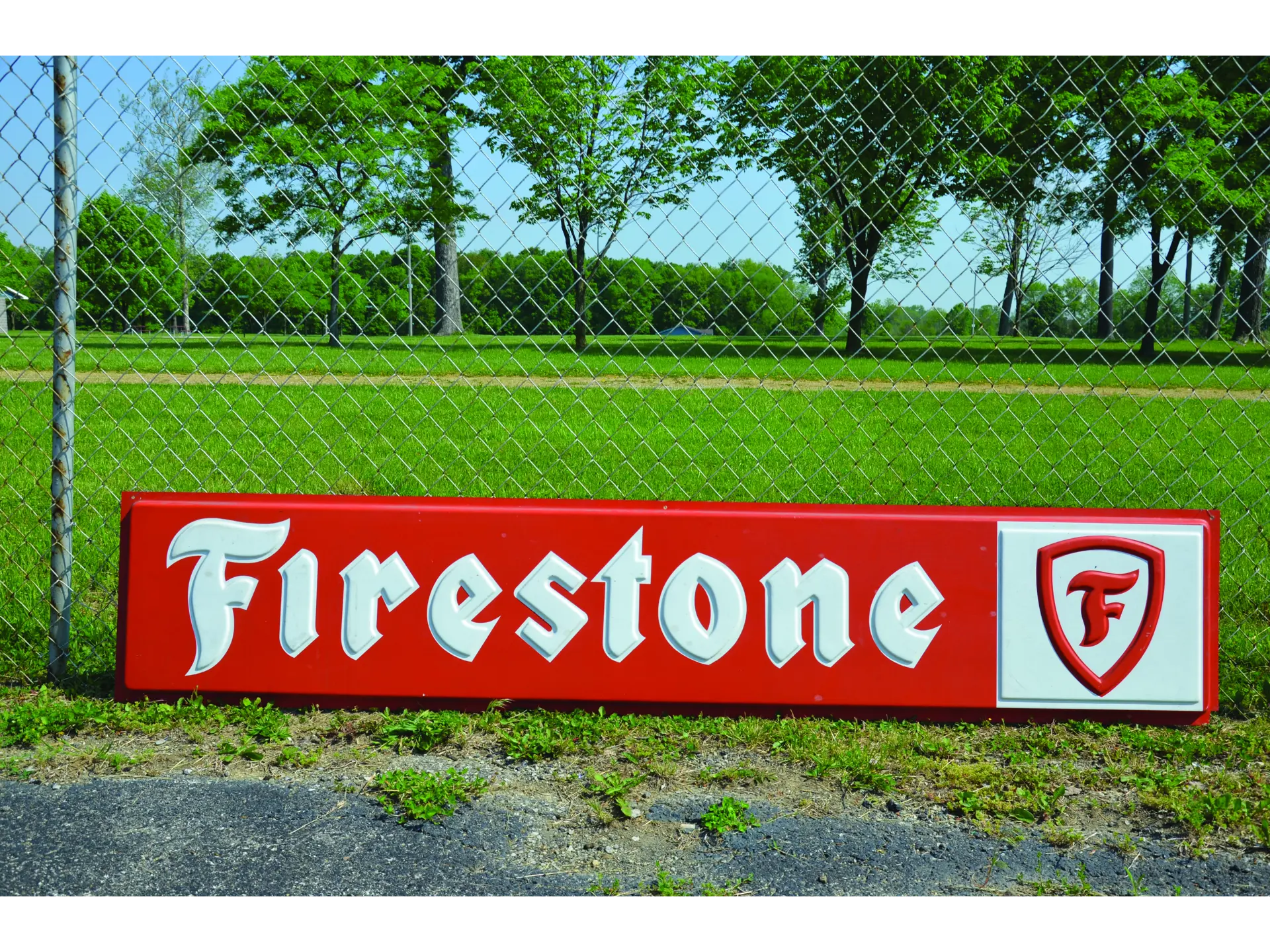A large horizontal Firestone plastic sign | Auburn Fall 2016 | RM Sotheby's