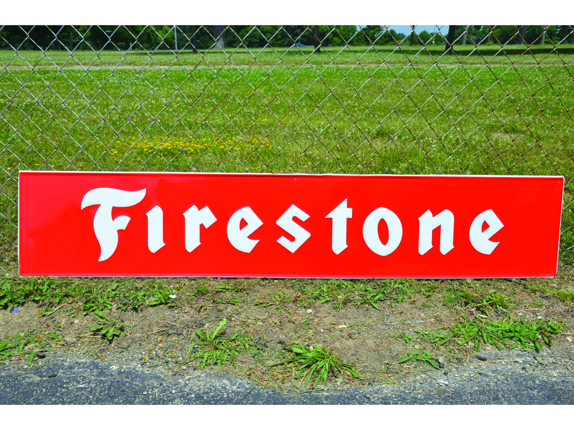 A single-sided, tin painted’ Firestone tires’ sign, 71.5" x 14 ...