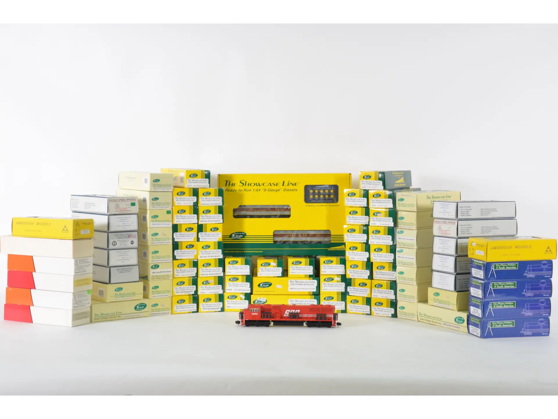 A large quantity of the “Showcase Line” S scale model railroad cars ...