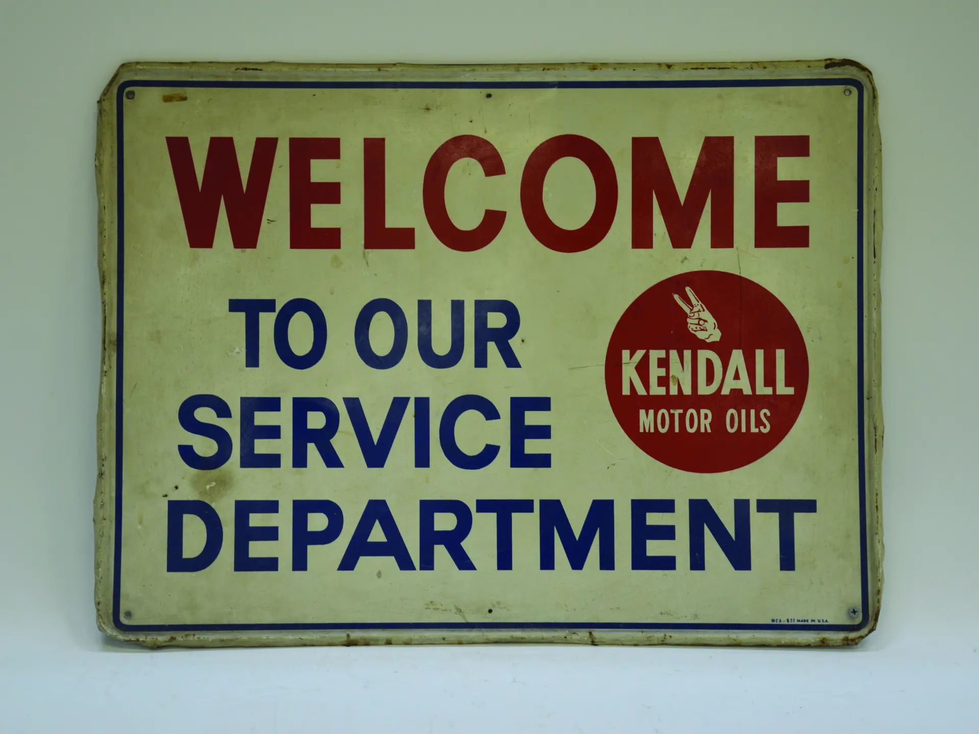 A tin painted, ‘Welcome to our service department’ Kendall motor oil ...