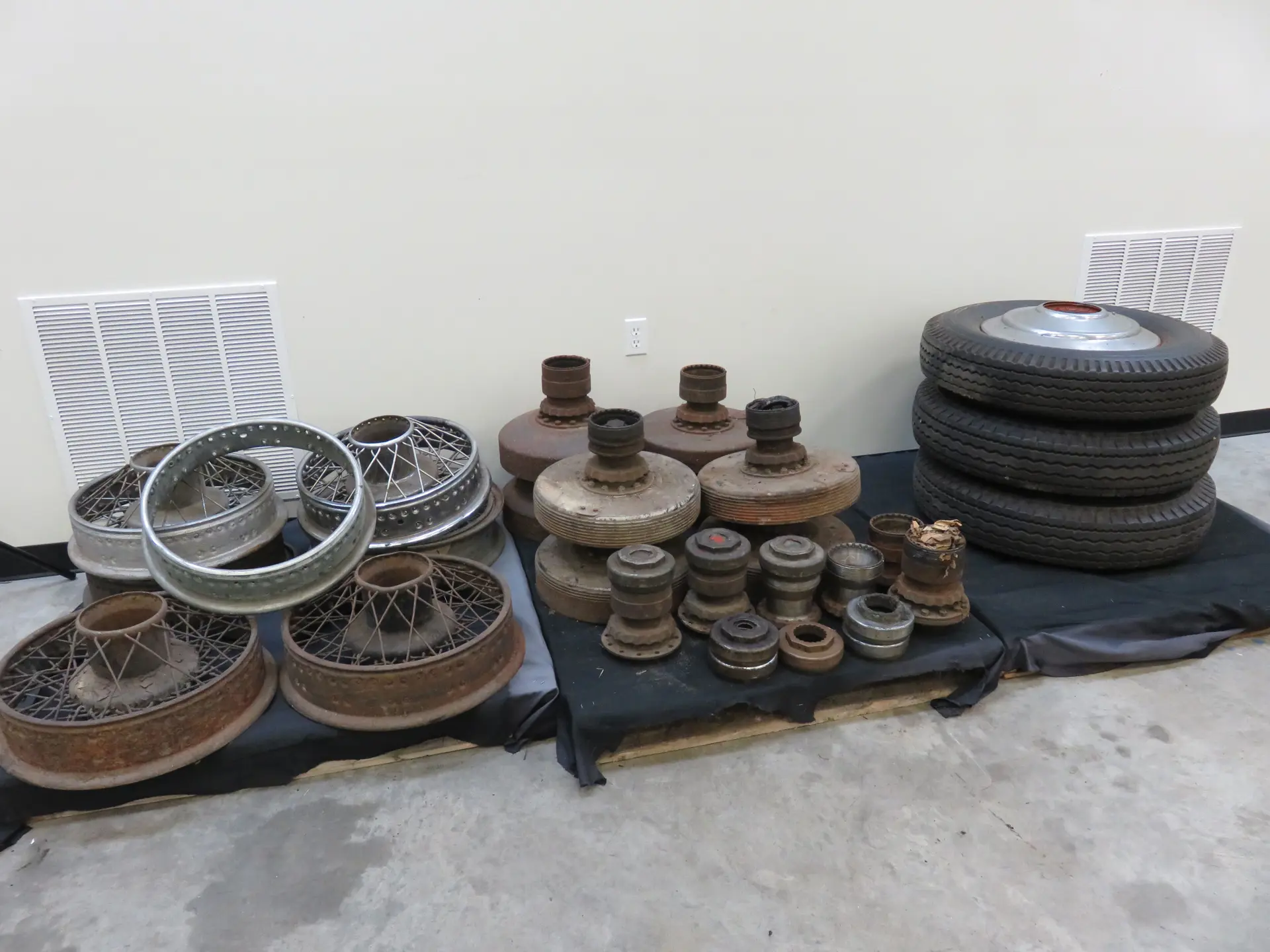 Assortment of Buffalo Wire Wheels With Hubs, Brake Drums, and Center ...