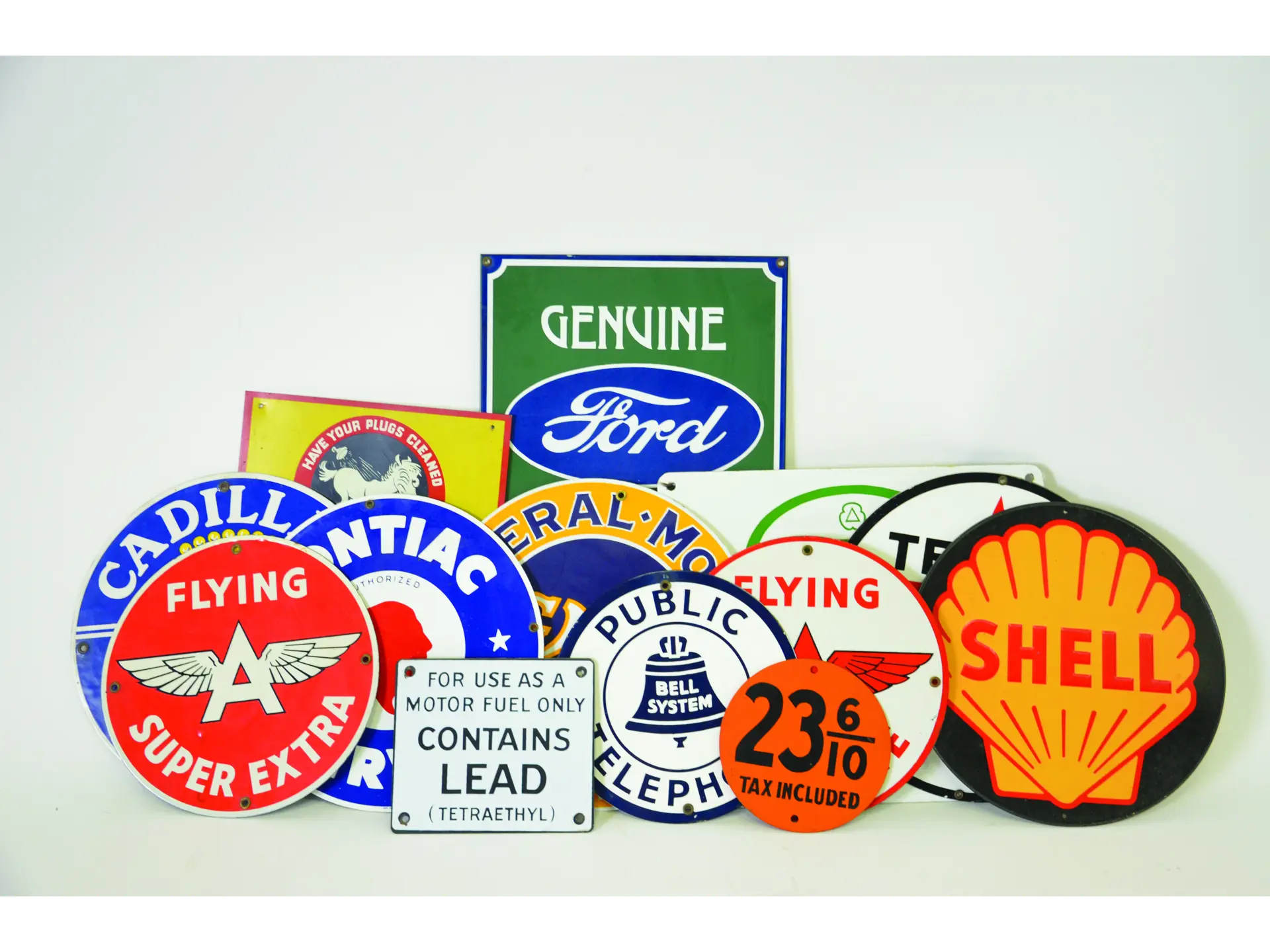 A comprised lot of vintage replica gas and oil advertising signs ...