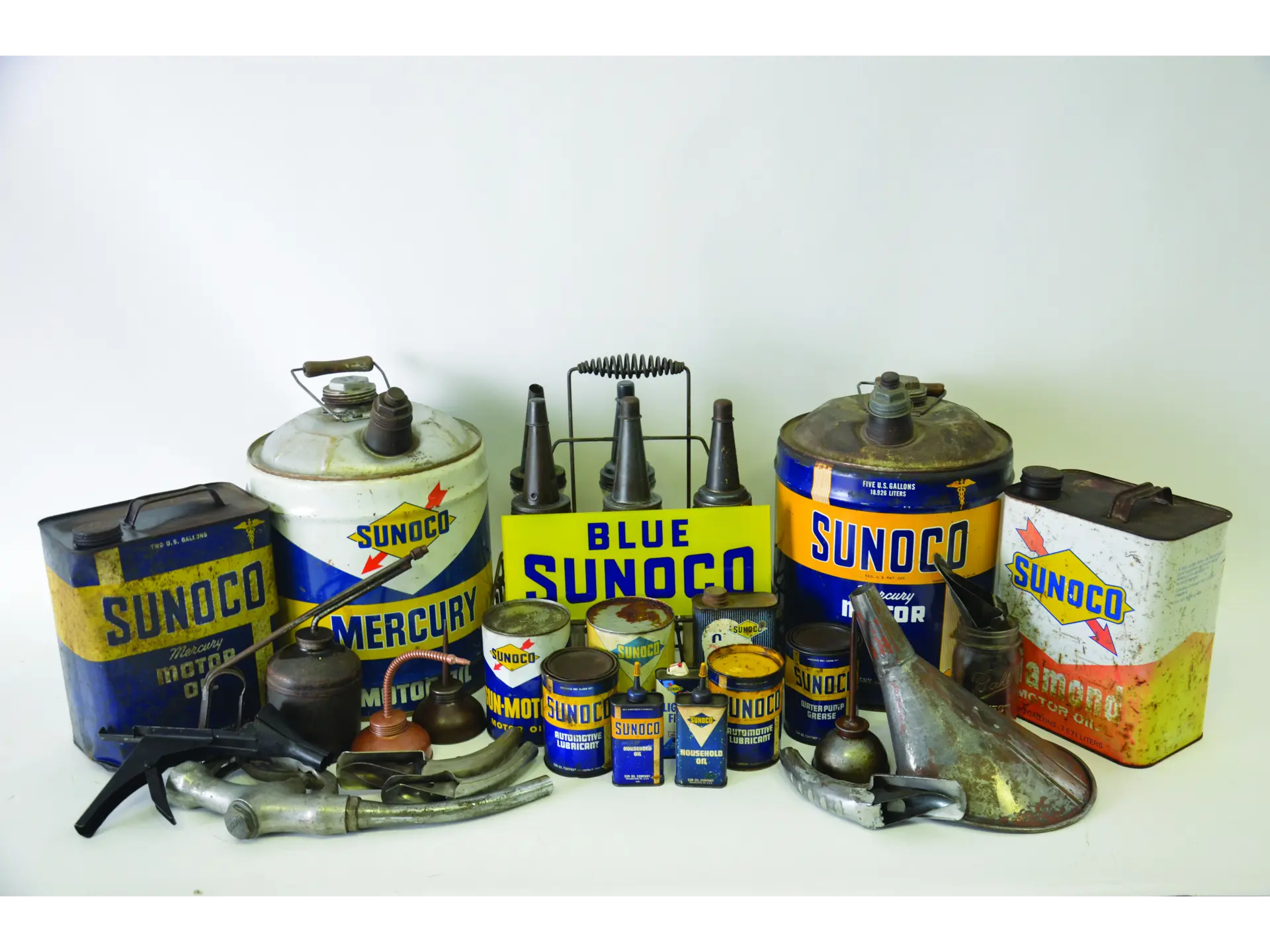 A collection of Sunoco oil cans glass oil bottles. | Auburn Fall 2016 ...