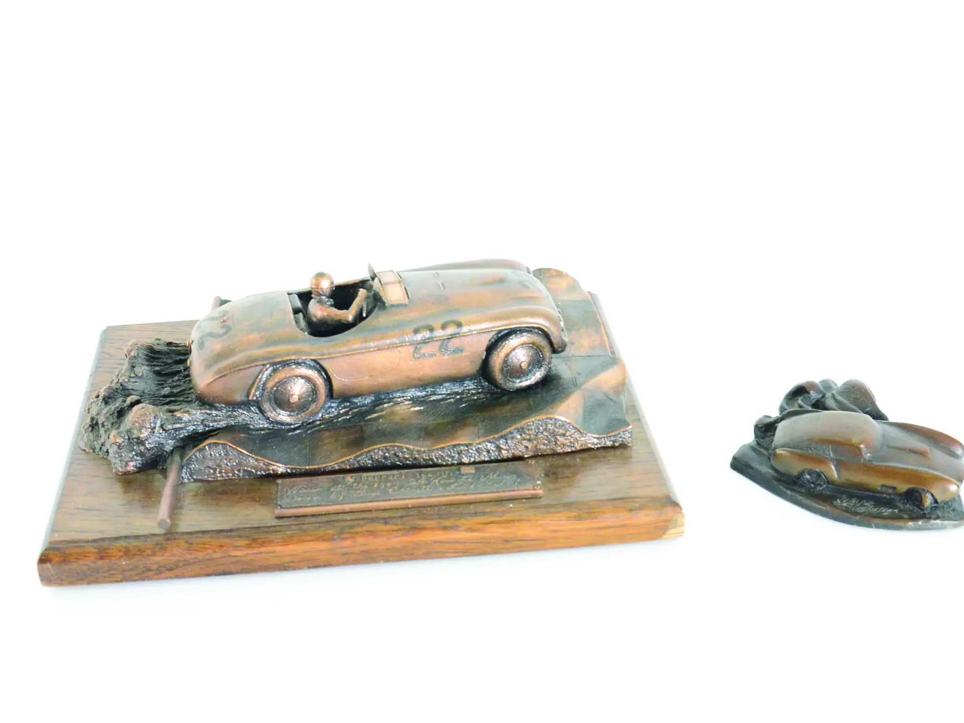 A comprised lot of two Ferrari themed bronze sculptures. | Auburn ...