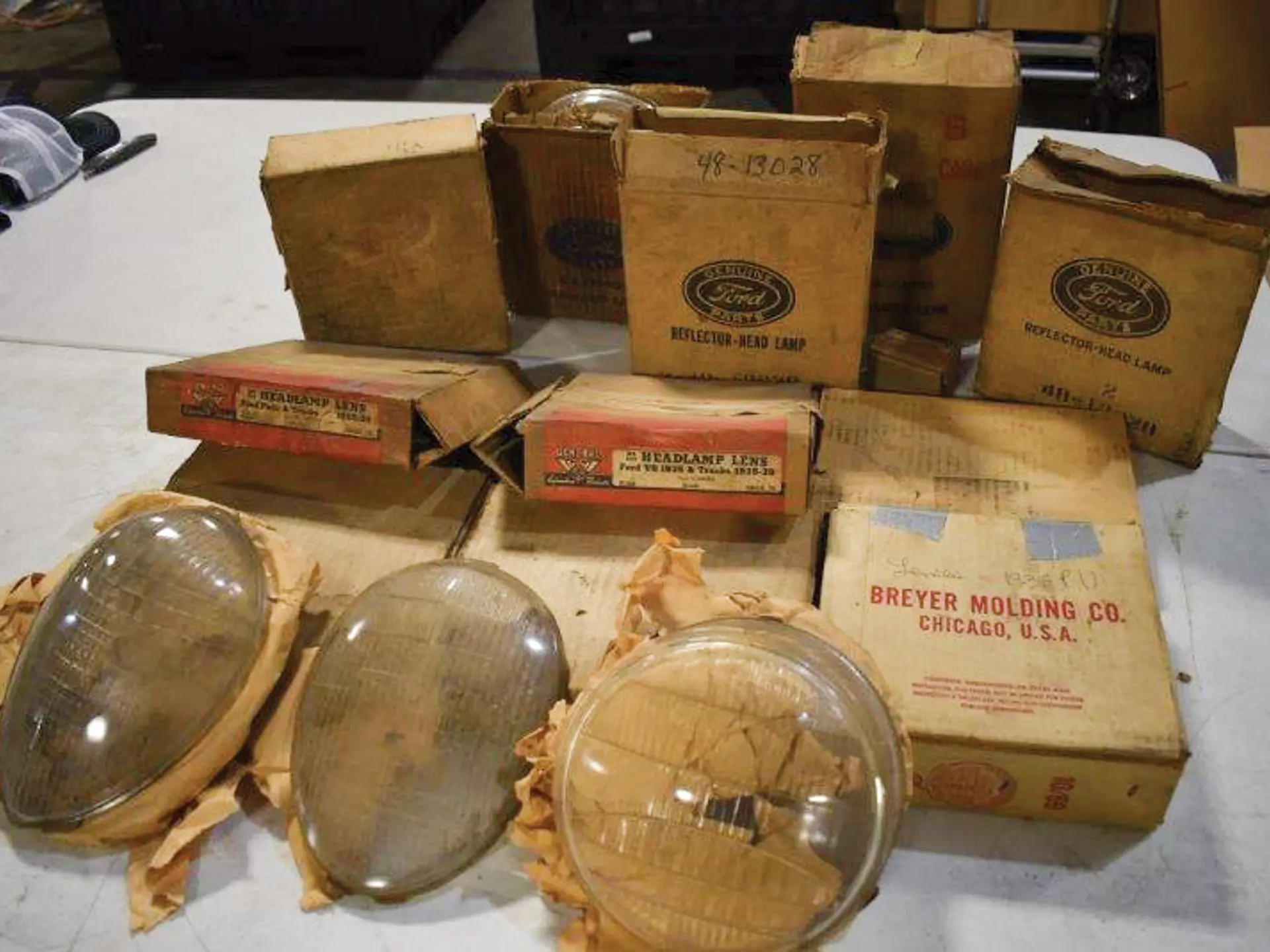 Group of NOS 1930’s Ford headlamp lenses | Auburn Fall 2019 | RM Sotheby's