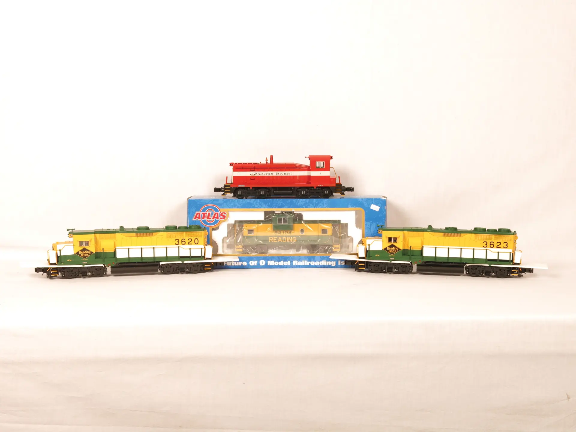Two Atlas O Gauge GP-35 Diesel Locomotives, One SW900 Diesel Locomotive ...