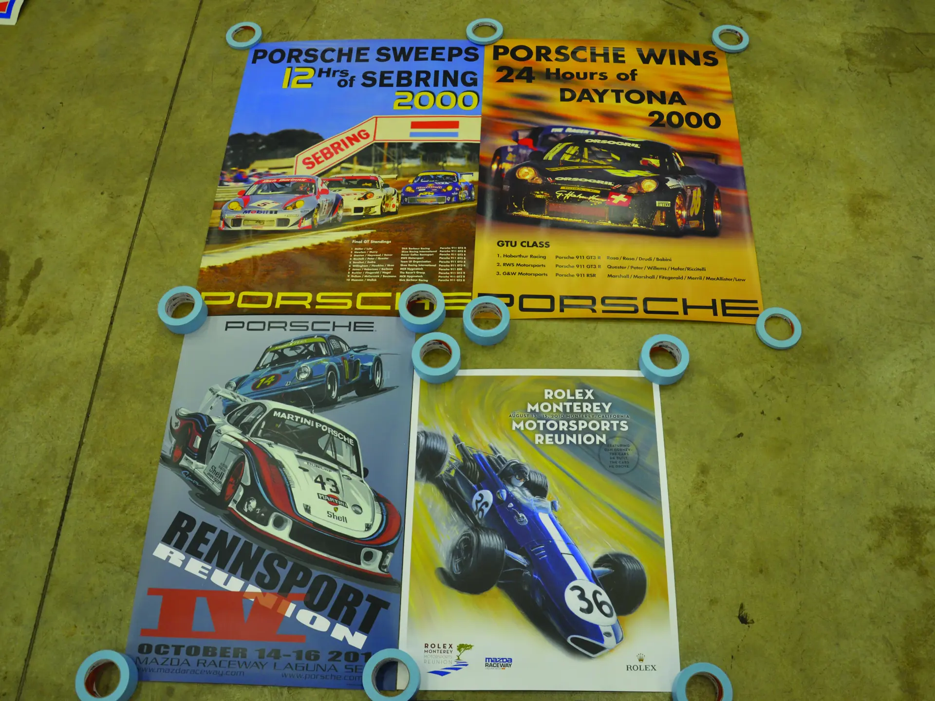 A group of four Porsche racing posters. | Auburn Fall 2017 | RM Sotheby's