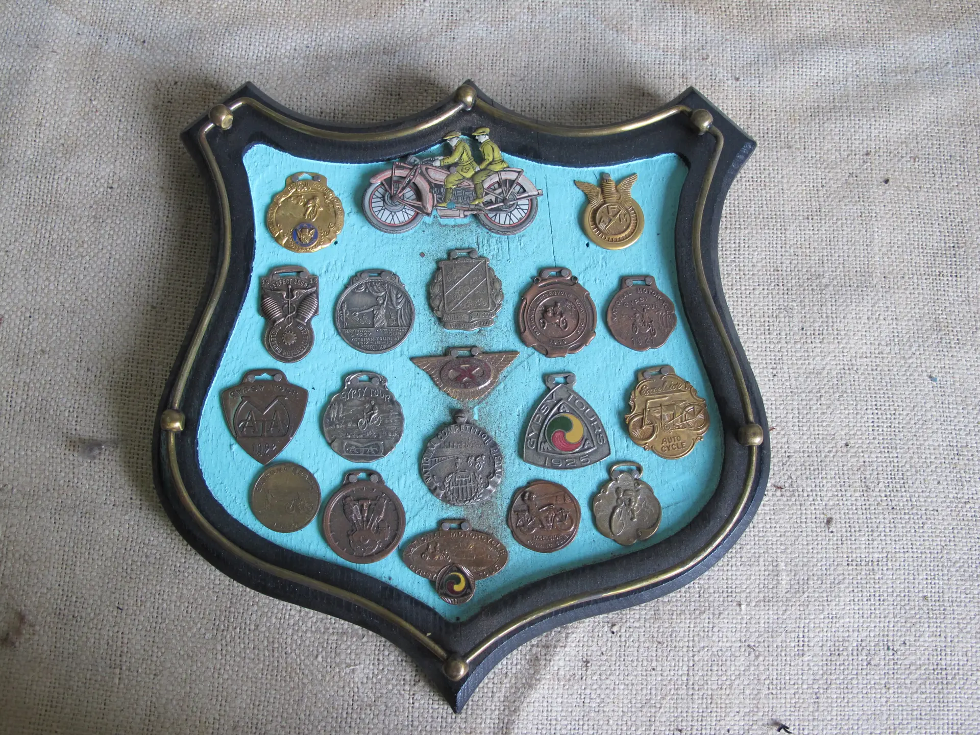 Motorcycle Tour Badges | The Lee Roy Hartung Collection | RM Sotheby's