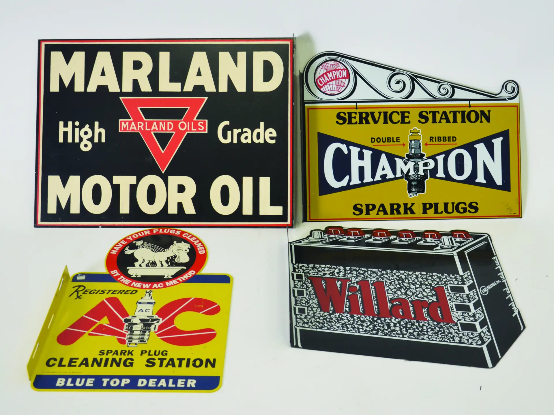 A grouping of high-quality reproduction advertising flange signs ...