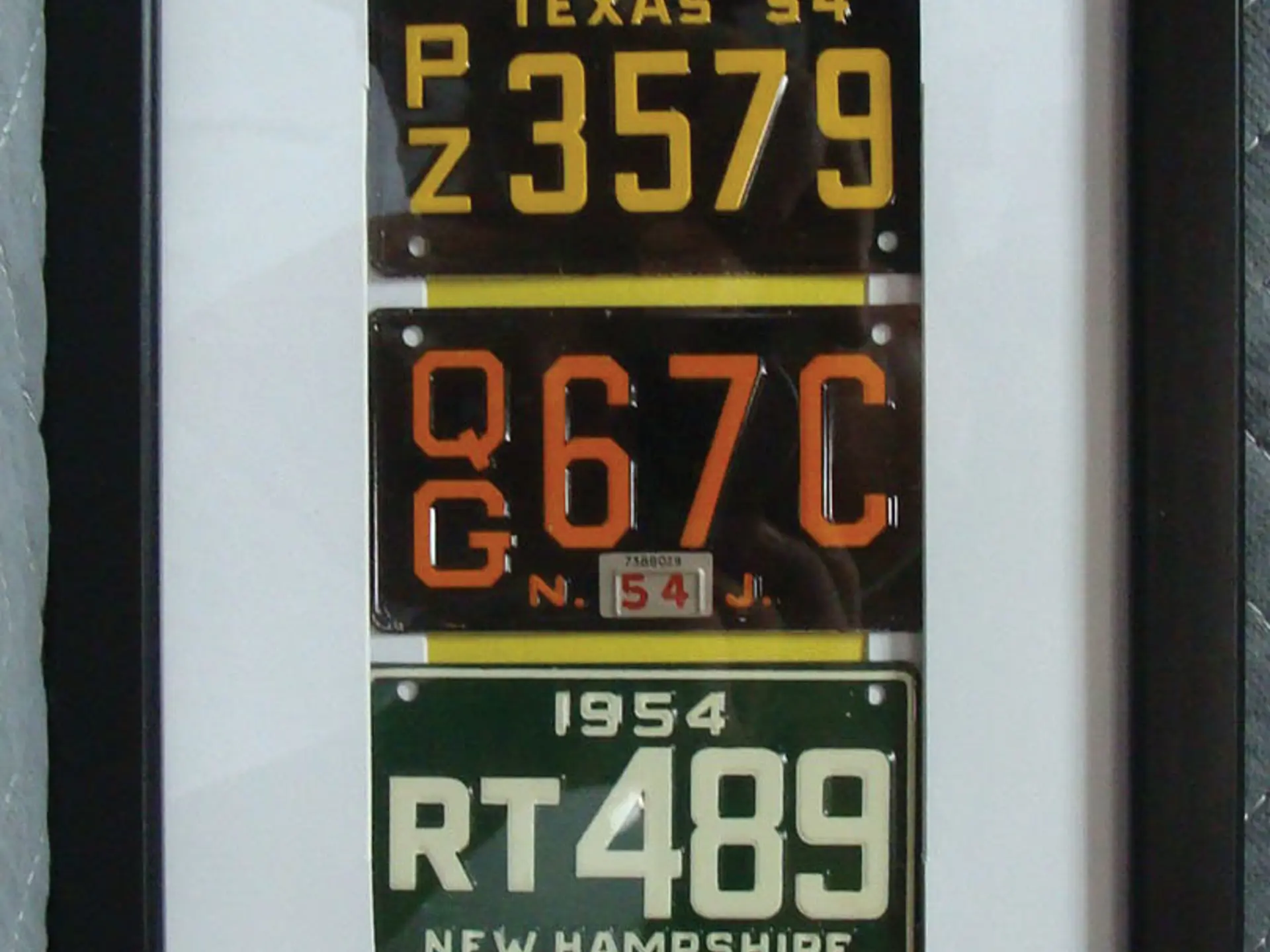 Framed Assortment of Miniature License Plates North Dakota, Texas ...