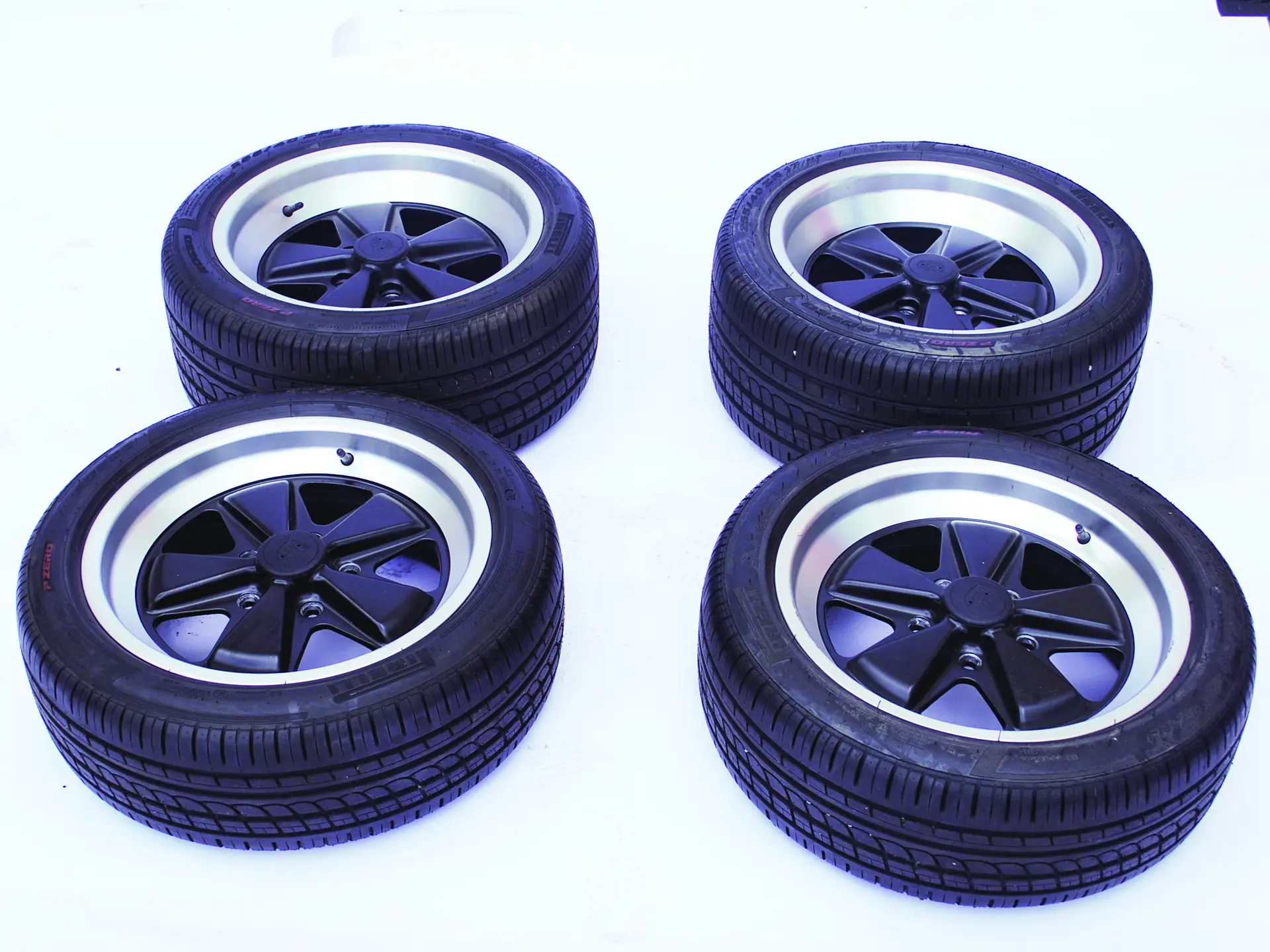 A set of four replica Porsche Fuchs aluminum wheels | Auburn Fall 2016 ...