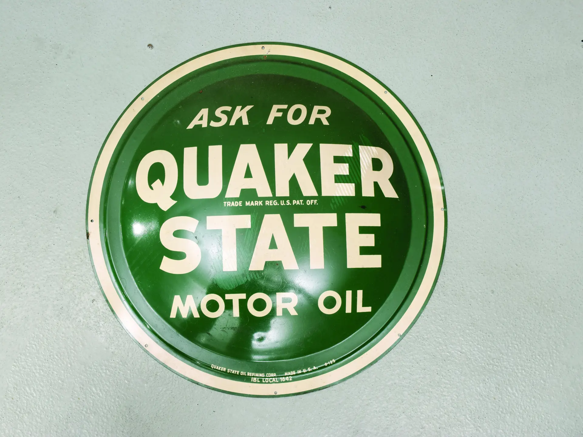 A convex, “Ask for Quaker State motor oil,” tin painted sign, 24 inch ...