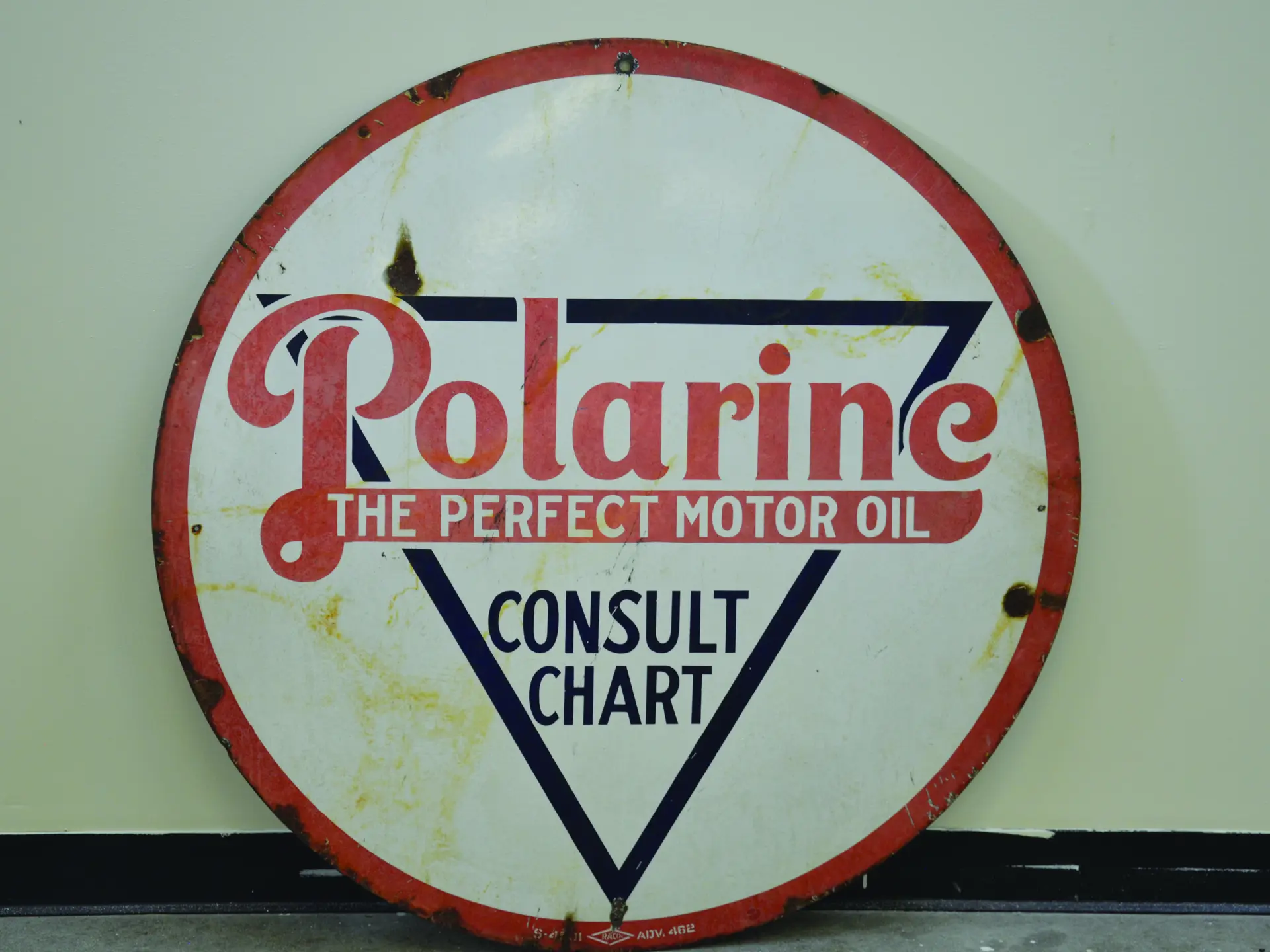 A single-sided, porcelain ‘Polarine motor oil’ sign, 42 inch diameter ...