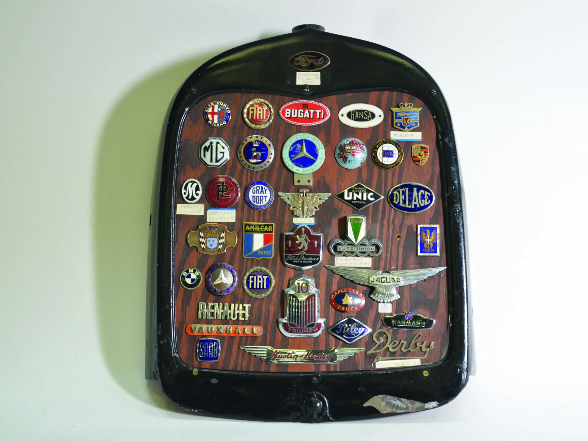 A foreign automobile badge collection. | Auburn Fall 2016 | RM Sotheby's
